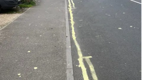 DIY double yellow lines painted on Southampton road