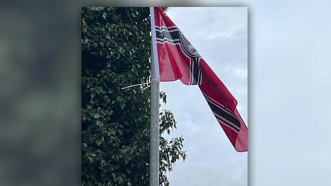 Nazi flags near Dunmurry mosque 'reminds me I am a stranger' - BBC News