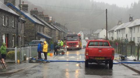 Wales suffers floods and power cuts as wind and rain hits - BBC News