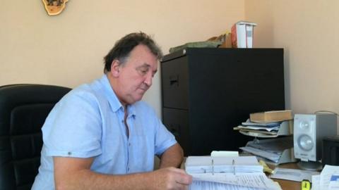 Child abuse images accused John Maughan wins payout - BBC News