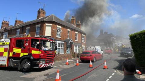 Firefighter treated in hospital after blaze in Rushden - BBC News
