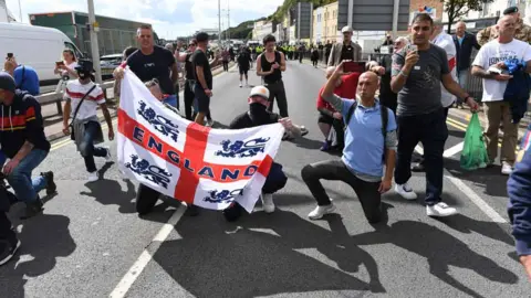 Dover immigration protesters and police clash at port