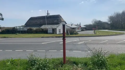 Red road sign stolen from Red Post near Bude