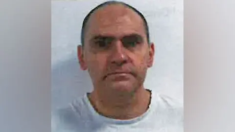 Police hunt after killer absconds from mental health facility