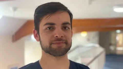 Migrant carer 'drowning' in debt after £15k visa scam