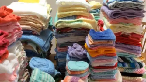 'Sackfuls' of knitted sleeves donated after viral appeal