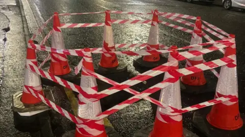 Newry: Vehicles damaged by '4ft-deep' collapsed manhole
