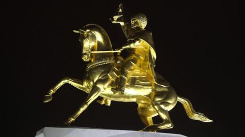Turkmenistan leader unveils giant gold dog statue - BBC News