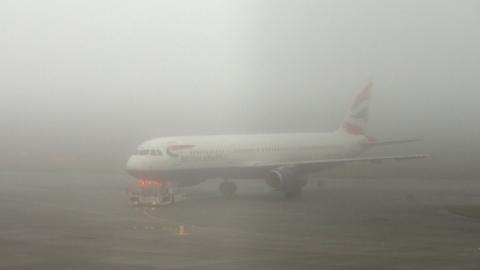 Fog causes major disruption to flights at UK airports - BBC News