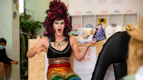 Drag queen Sab Samuel to continue story time despite hate mail