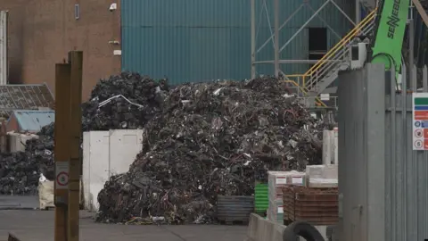 Crews put out fire at Birmingham scrap metal yard