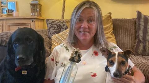 Solva: Builder finds message in a bottle behind fireplace - BBC News