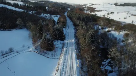 Ice warning after snow travel delays