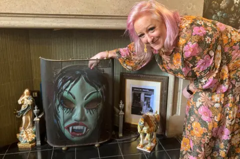 Edinburgh pink door woman sad after being forced to repaint