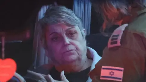 Son's 'sheer happiness' at hugging mother after Hamas release