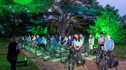 Ancient Cambridge tree lit up for Coronation by pedal-power