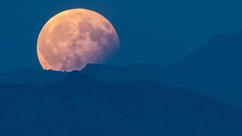 Red Moon rising: Photos from the partial lunar eclipse