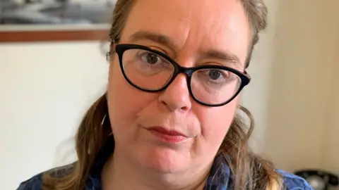 Solihull vicar who knew of husband's sex abuse struck off