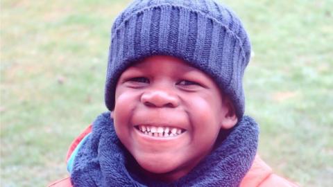 Boy arrives in UK after Uganda adoption battle - BBC News