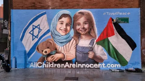 Israel-Gaza peace mural in east London defaced