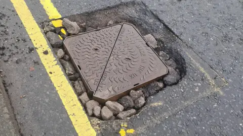 Newry: Vehicles damaged by '4ft-deep' collapsed manhole