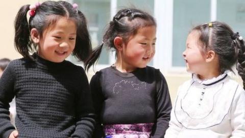 China hints at three-child policy with 'happy family' stamps - BBC News