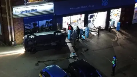 Leeds robbers flee on foot after getaway vehicle toppled