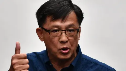 Pro-Beijing lawmaker stabbed by 'fake supporter' in Hong Kong