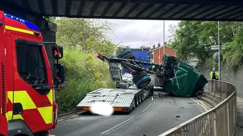Stoke-on-Trent: Road shut after lorry toppled in bridge strike
