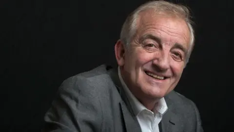 Merry Christmas Everyone songwriter dies aged 76