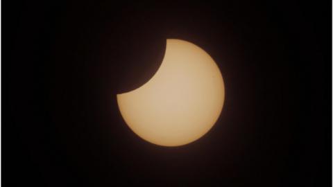 Solar eclipse: Partial solar eclipse captured across the UK - BBC Newsround