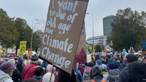 Climate change protesters and sports fans descend on Cardiff - BBC News