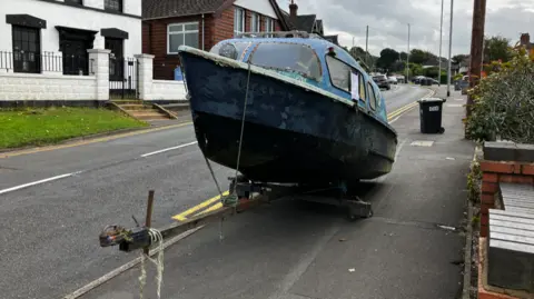 Search for owner of boat left on Stoke-on-Trent street
