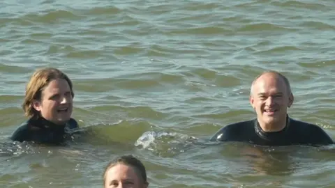 Sir Ed Davey splashes in Sheringham for election campaign