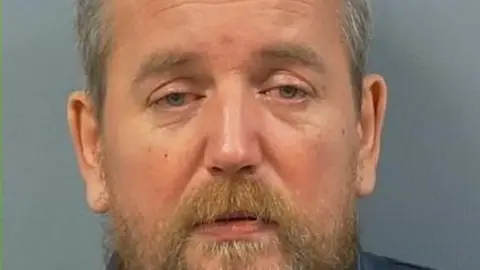 Man jailed for attacking blind wife with meat cleaver