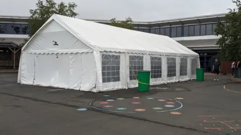 Pop-up pool in playground helping pupils to swim