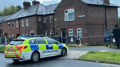 Woman, 40, and girl, 8, found dead in Salford home