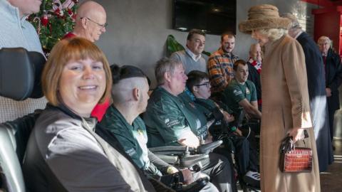 Wrexham: King and Queen Consort meet Hollywood royalty - BBC News