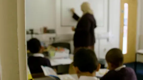 Defiant head vows to keep unregistered school open