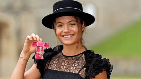Emma Raducanu: Tennis star receives MBE at Windsor Castle
