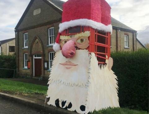Phone box gets festive Santa makeover in Prickwillow - BBC News