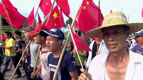 Wukan's 'rebel' villagers take to streets in ongoing protest - BBC News