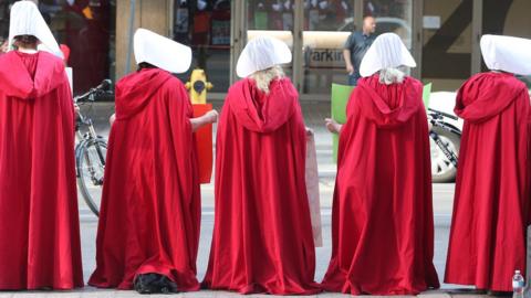 How the handmaid became an international protest symbol - BBC News