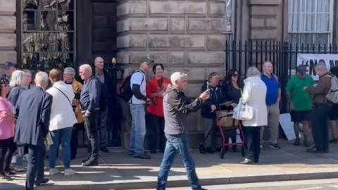 Liverpool: Protesters disrupt meeting over non-existent policy - BBC News