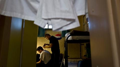 In pictures: The Dutch prison asylum seekers call home - BBC News
