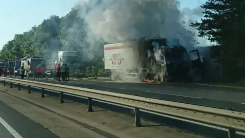 A14 lorry driver wakes to find cab in fire in Cambridgeshire