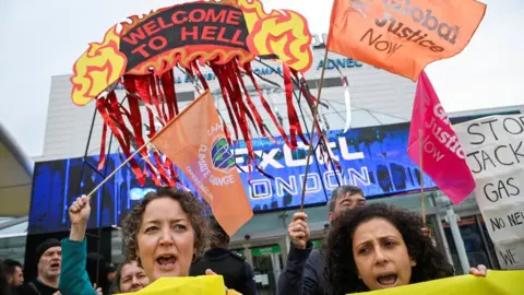 Shell AGM: Climate activists storm shareholder meeting