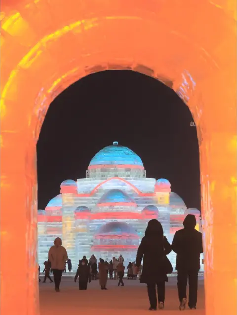 Building frozen castles at China's Harbin Ice Festival
