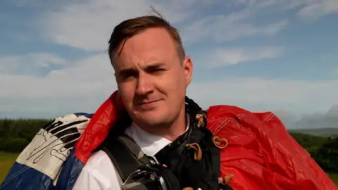 Groom skydives into wedding ceremony