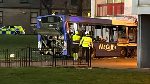Five taken to hospital after bus crashes into Paisley flats